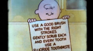 Charlie Brown teaches Snoopy & Linus proper brushing techniques